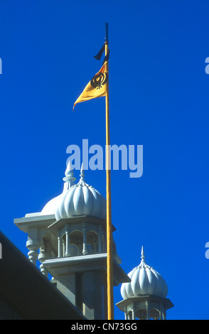 Sikh flag or Nishan Sahib flying outside a Sikh temple or Gurdwara ...