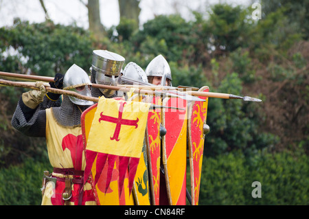 "History in action" re-enactment. Five knights in a defensive stance ...