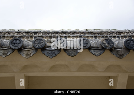 Closeup of round japanese roof tiles seen from below Stock Photo - Alamy
