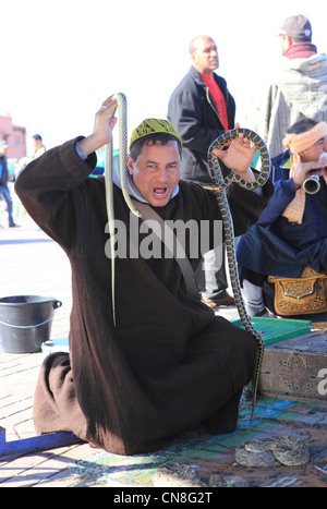Snake charmer in Djemna El Fna square, Marrakech, Morocco Stock Photo ...