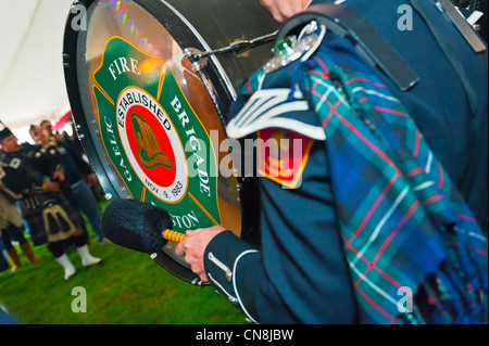 Boston Gaelic Fire Brigade Pipes and Drums drummer in kilts from behind ...