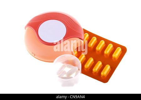 Blisterpack, plastic container with pills and inhaler. Medications and ...