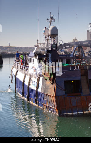 Deep sea trawlers sailing from the port of Peterhead.N.E.Scotland UK ...