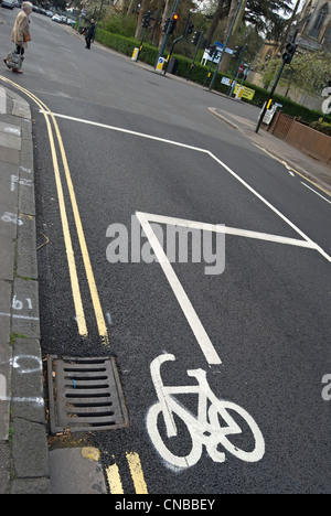 british road junction with advanced stop line, or cycle box, marked by ...