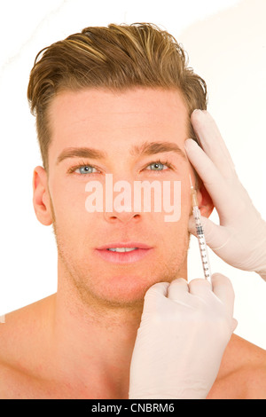 young man doing botox injections Stock Photo - Alamy