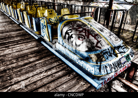An abandoned roller coaster train in the funfair in Treptower Park (aka ...