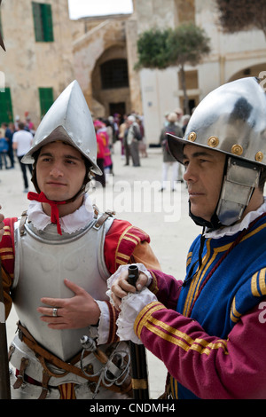Medieval knight in armor talking on a cell phone. Isolated on white ...