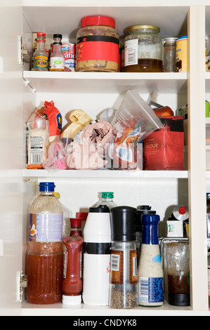 Kitchen cupboard contents showing cooking ingredients, food stuffs and ...