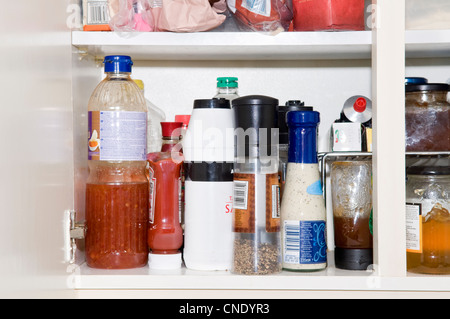 Kitchen cupboard contents showing cooking ingredients, food stuffs and ...