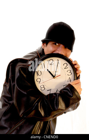 Thief stealing a clock Stock Photo - Alamy