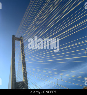 Bridge architecture, pylon and steel cables structure, clear blue sky ...