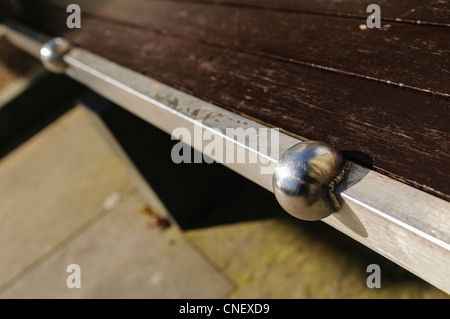 Anti-skateboarding devices installed on wooden benches Stock Photo - Alamy