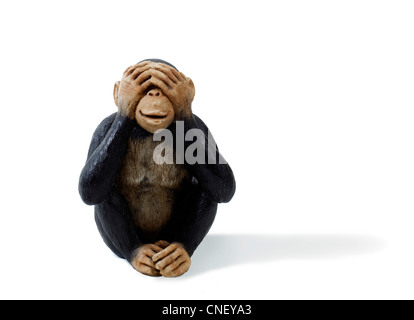 Studio shot of a toy monkey holding hands over ears. hear no evil Stock ...