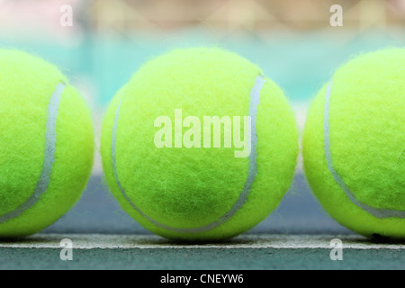 Row colorful tennis balls in green and pink Stock Photo - Alamy