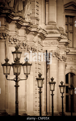 Lamp posts and columns at the Louvre Palace, Louvre Museum, Paris ...
