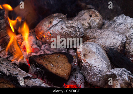 hot potato, potato on fire with flames Stock Photo - Alamy