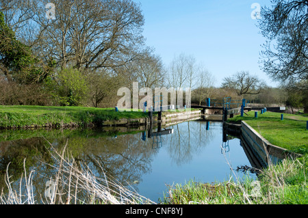 Open lock on river Chelmer with still water and reflection of balance ...
