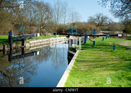 Open lock on river Chelmer with still water and reflection of balance ...
