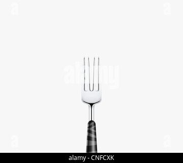 Sharp metal fork on white background Stock Photo - Alamy