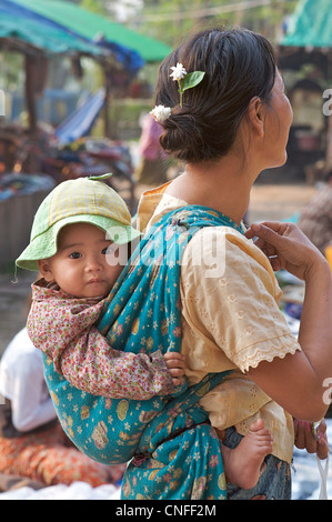 Shan woman carrying baby at the market, Inle Lake, Myanmar Stock Photo ...
