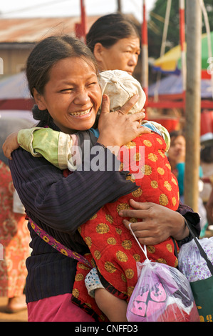 Smiling Burmese mother carrying her child Stock Photo - Alamy