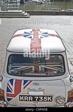 A classic Mini Cooper with a Union Jack roof outside the Great British ...