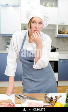 Attractive chief cook preparing food, cuts broccoli Stock Photo - Alamy