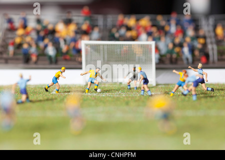 Miniature figurines of two soccer teams playing a soccer match Stock ...