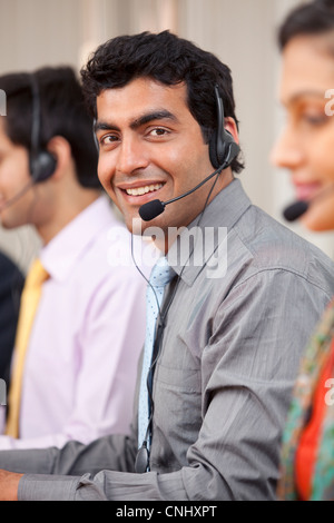 Young man call center agent having video call at office Stock Photo - Alamy