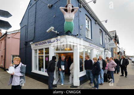 People queue outside The Golden Galleon fish and chip shop at Aldeburgh ...