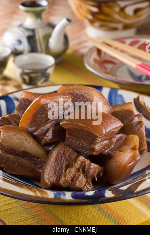Rafute Okinawan Braised Pork Belly with rice closeup in the plate on ...