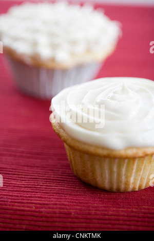 Blue Frosted Vanilla Cupcake with edible pearl decorations Stock Photo ...