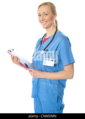 Adult experienced woman doctor with stethoscope and folder look at ...