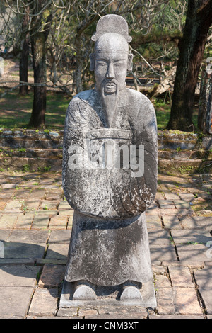 carved stone mandarin statues guard the mausoleum of emperor Tu Doc one ...
