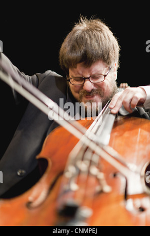 A person with glasses in classical clothes expressing his conclusion ...