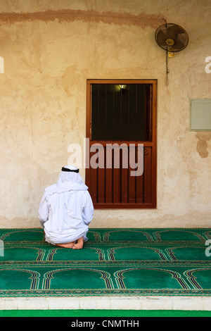 Muslim man praying or salah in a mosque. Islamic background photo ...