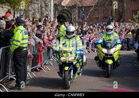 Police outriders motorbikes officer escorting the Queen's car during ...