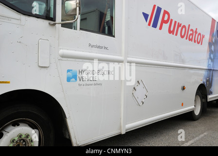Purolator hybrid delivery trucks Stock Photo - Alamy