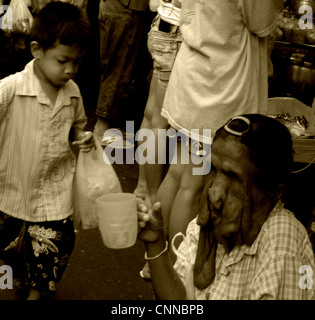 deformed lady begging for money , streets of bangkok, thailand Stock ...