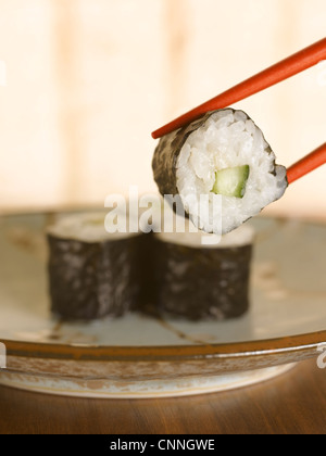 Close-up of chopsticks holding a cut open Chinese pork and shepherd's ...