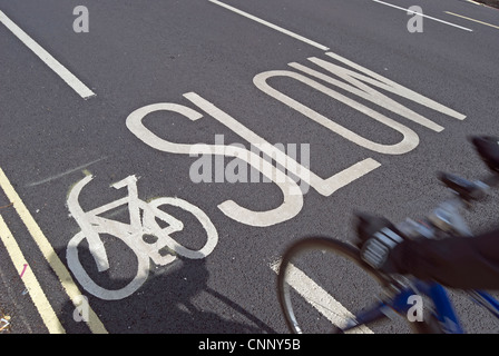 british road marking indicating a cycle lane and temporary sign ...