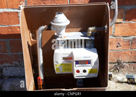Gas meter for a domestic gas supply in cupboard on wall outside house ...