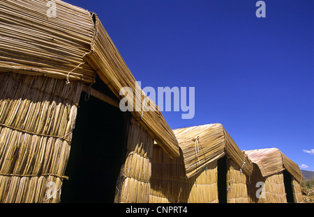 Straw houses on the floating islands of Uros in Lake Titicaca, Peru ...