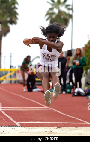 Young athlete competing in the long jump Stock Photo - Alamy
