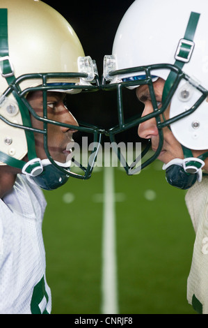Opposing football players facing off Stock Photo - Alamy