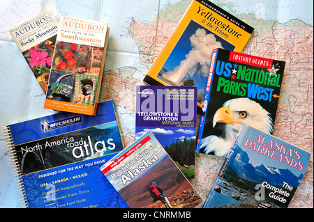 Road map and assortment of travel guides, guidebooks and wildlife books ...