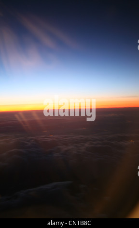 Sunset view out of airplane window Stock Photo - Alamy