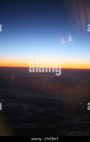 Sunset view out of airplane window Stock Photo - Alamy
