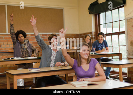 College student raising his hand in class Stock Photo - Alamy