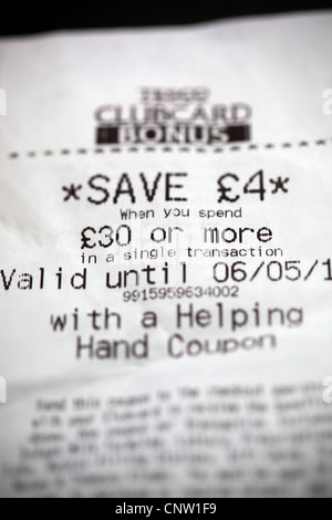 Tesco Helping Hand Discount Coupon Stock Photo - Alamy